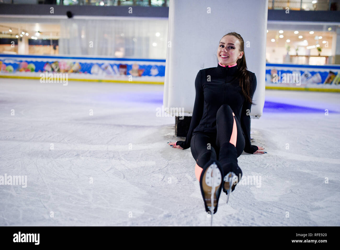Figure skater woman at ice skating rink Stock Photo - Alamy
