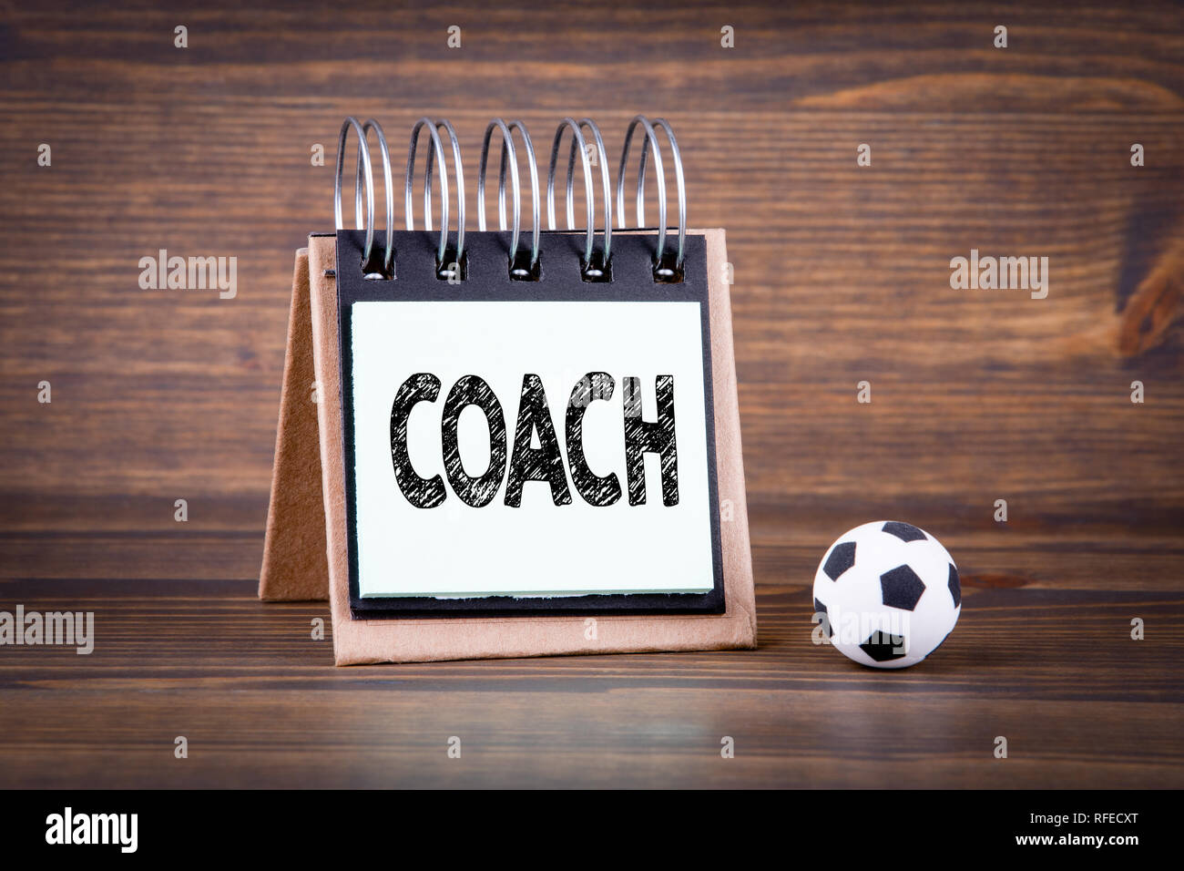 coach, wooden table with soccer bal Stock Photo - Alamy