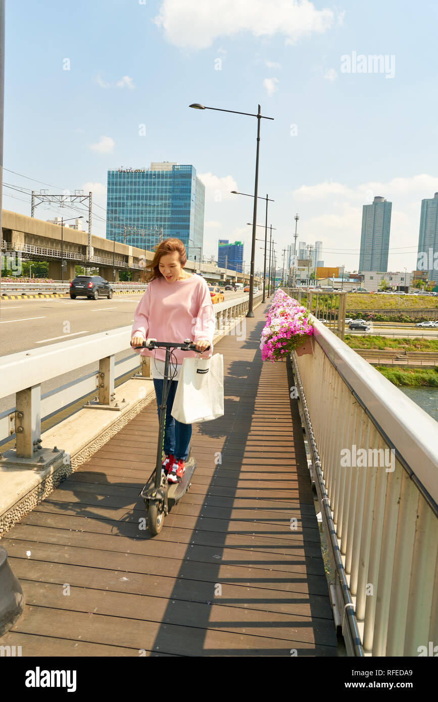 SEOUL, SOUTH KOREA - CIRCA JUNE, 2017: woman crossing bridge in Seoul ...