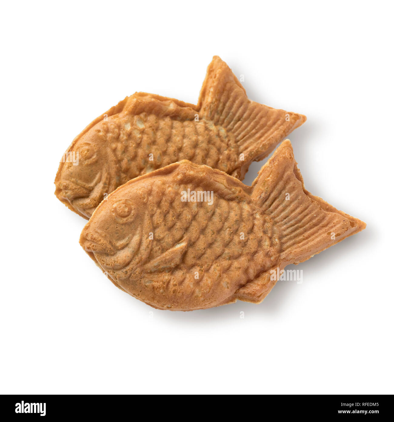 Fresh baked Taiyaki, Japanese fish shaped cake filled with red bean paste isolated on white ...