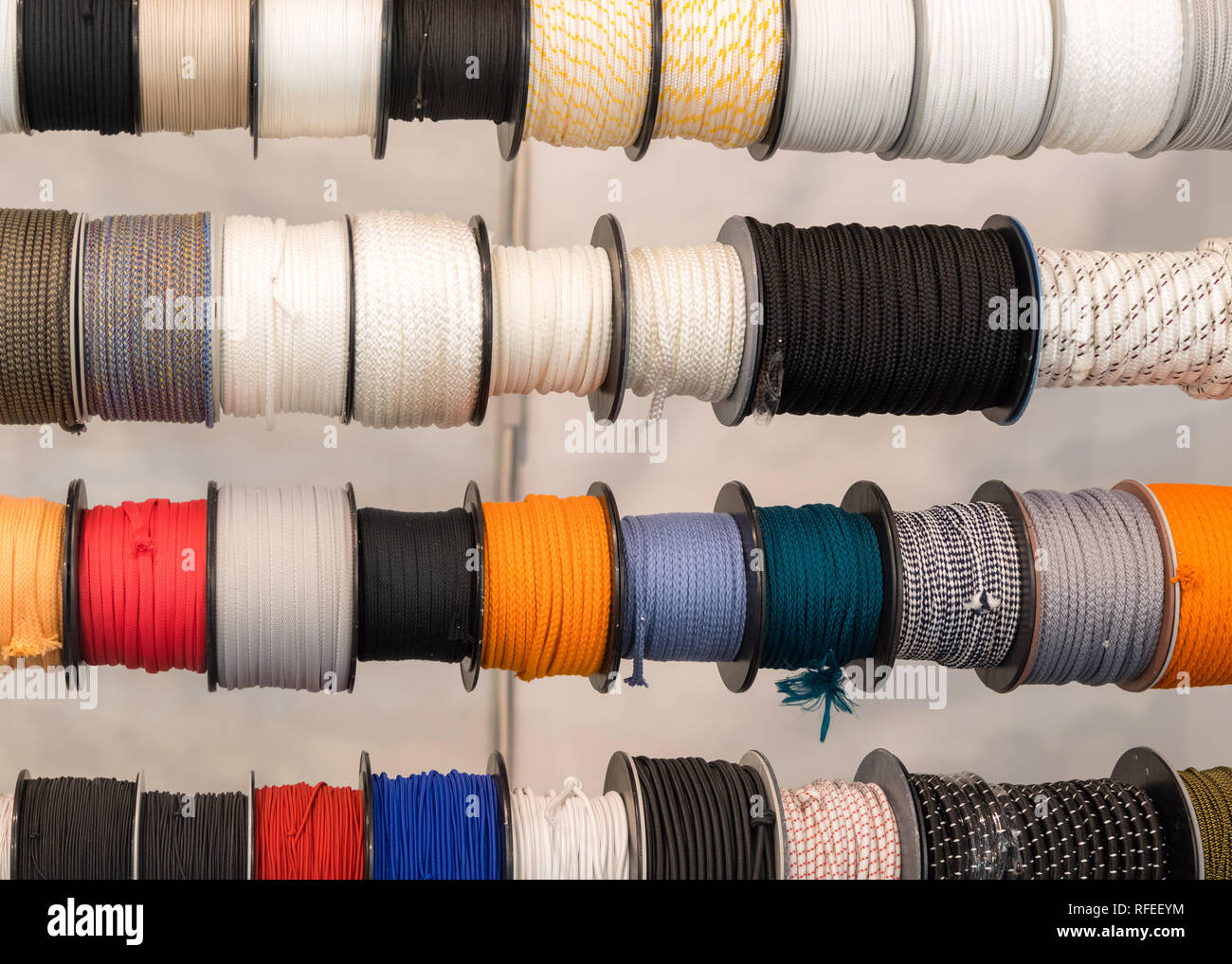 Colourful embroidery thread spool using in garment industry, row of ...