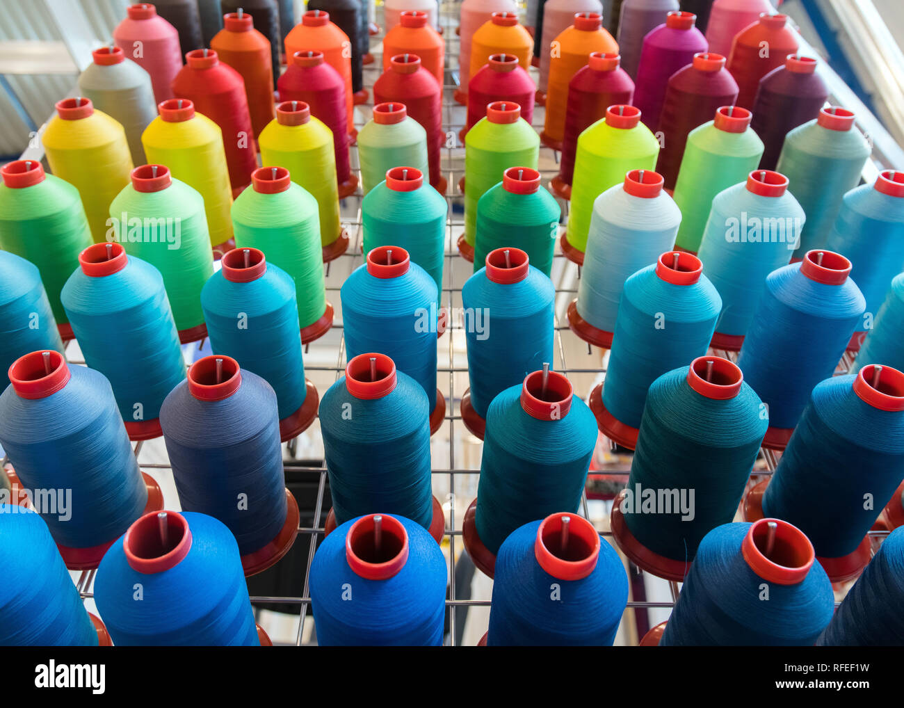 Colourful embroidery thread spool using in garment industry, row of ...