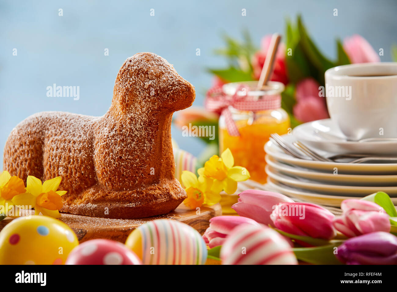 Easter tea table with a speciality lamb cake, decorated Easter eggs and ...