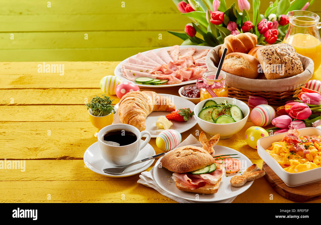Easter buffet breakfast or brunch with assorted bread rolls, cheese ...