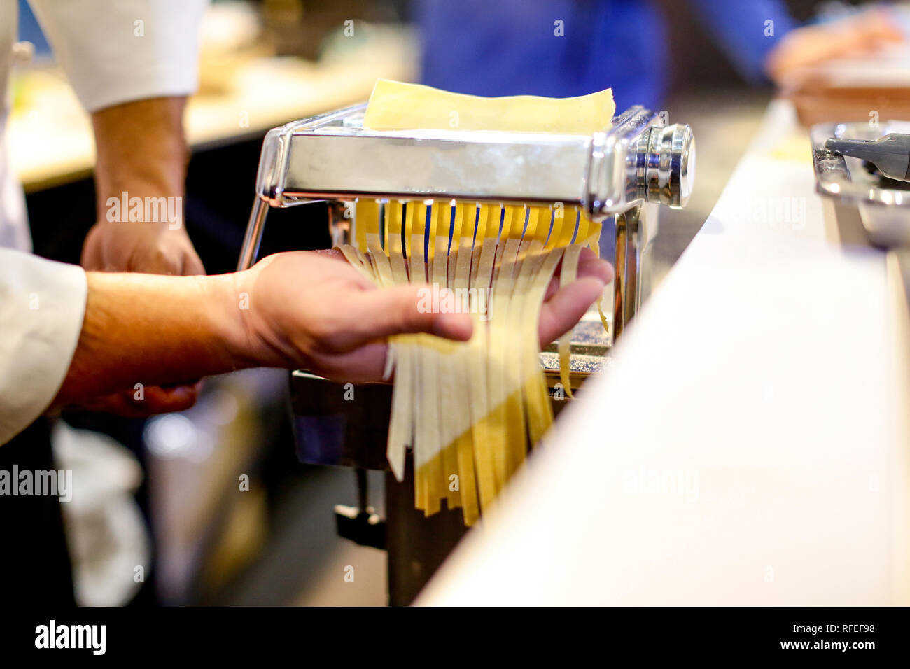 Chef making pasta with a machine, home made fresh pasta Stock Photo - Alamy