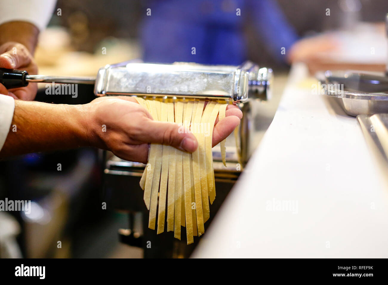 Chef making pasta with a machine, home made fresh pasta Stock Photo - Alamy