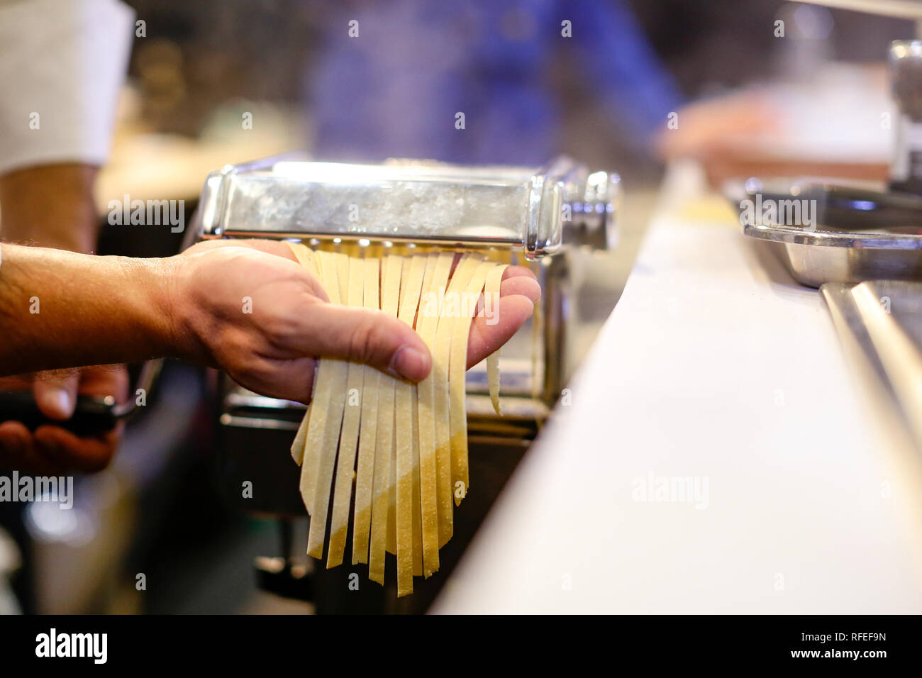 Chef making pasta with a machine, home made fresh pasta Stock Photo - Alamy