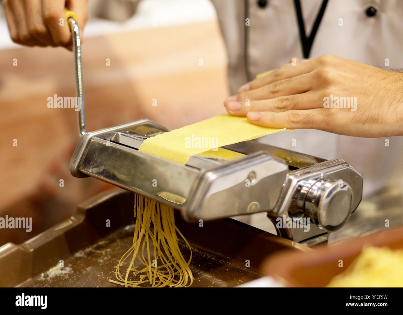 Chef making pasta with a machine, home made fresh pasta Stock Photo - Alamy