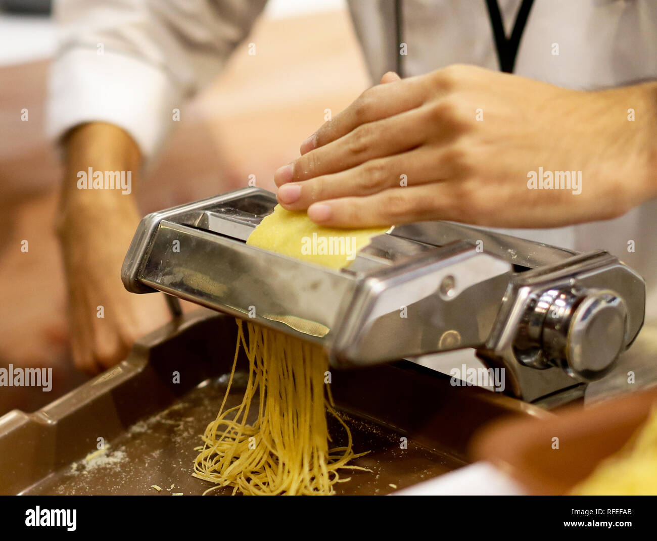 Chef making pasta with a machine, home made fresh pasta Stock Photo - Alamy