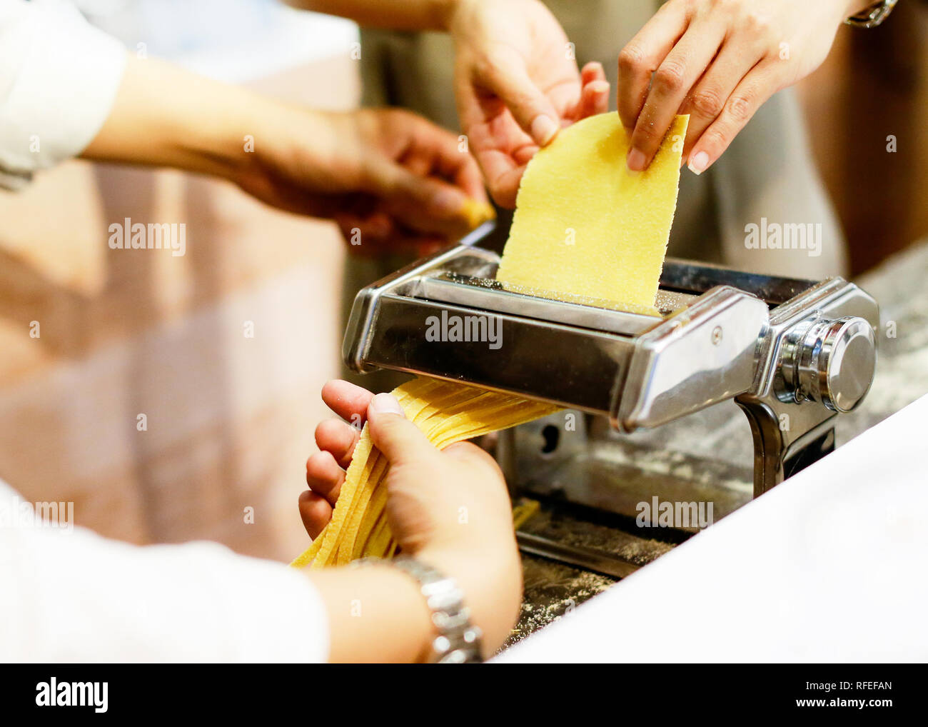 Chef making pasta with a machine, home made fresh pasta Stock Photo - Alamy