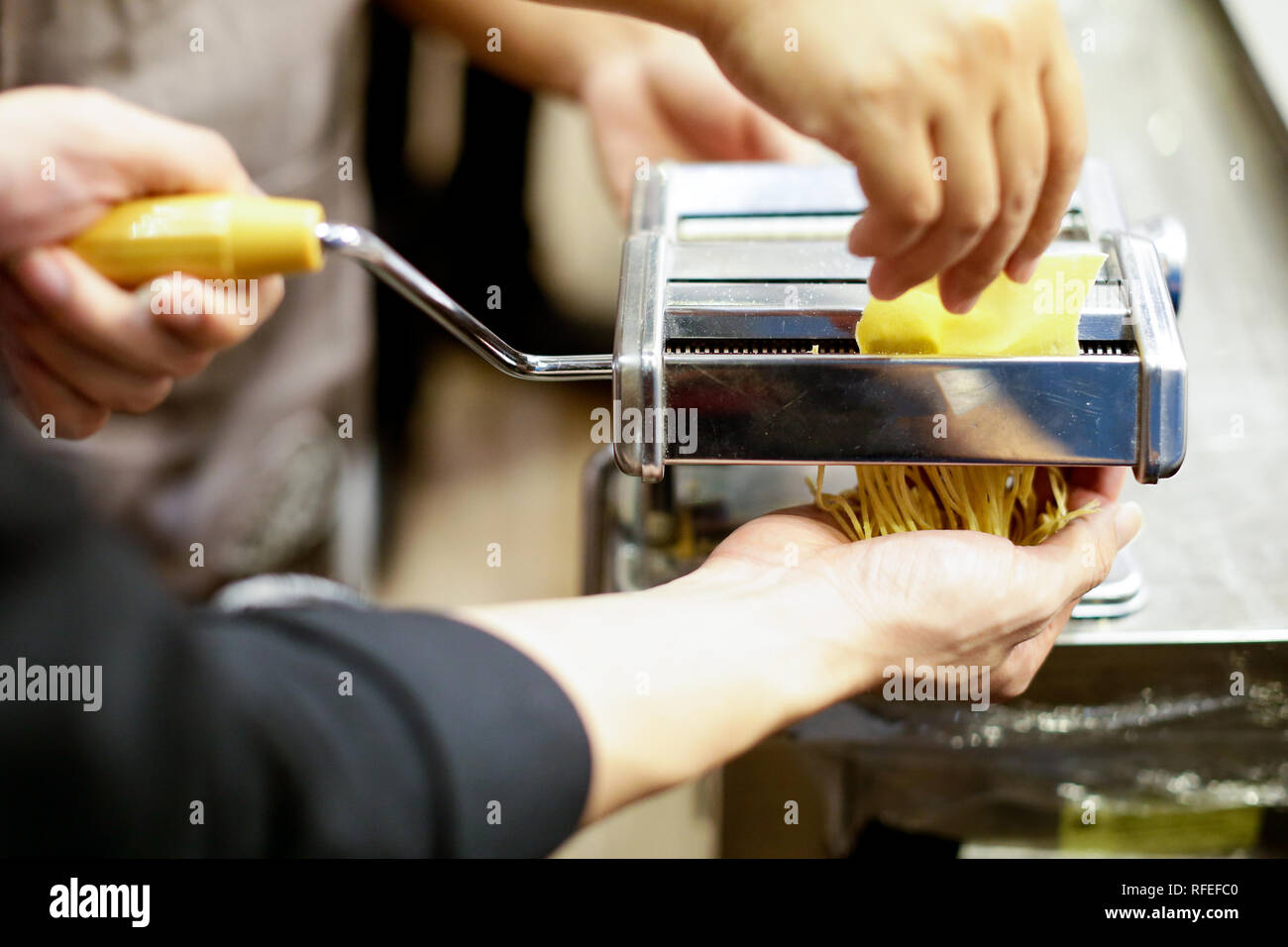 Chef making pasta with a machine, home made fresh pasta Stock Photo - Alamy