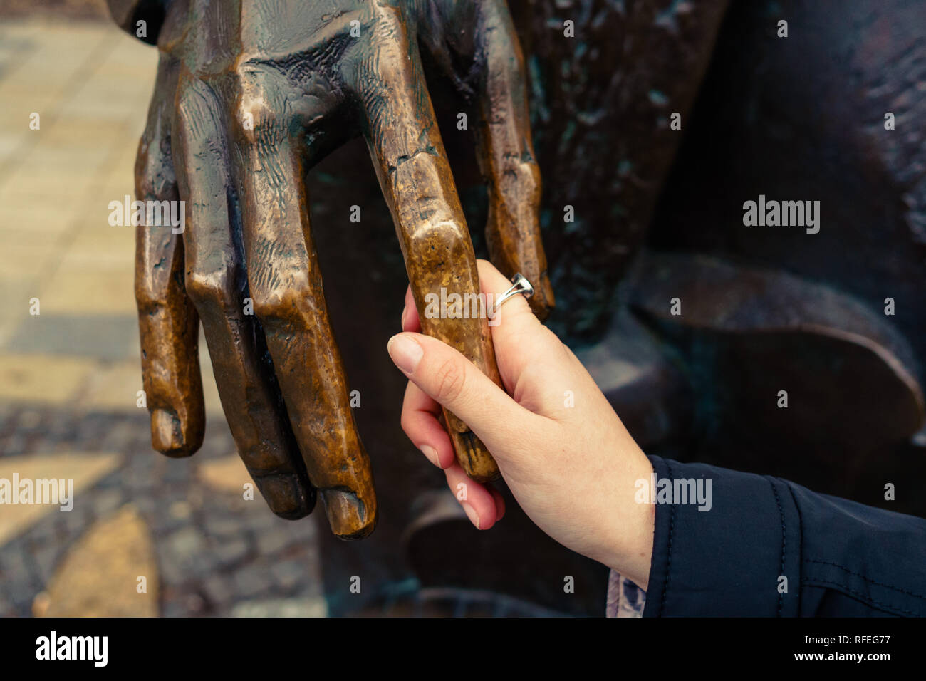 Girl hand touchs hans christian andersen statue. Touching the statue ...