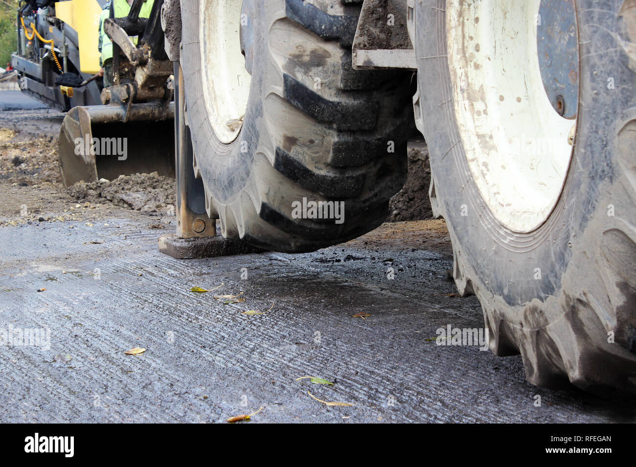 Tractor strong outrigger stabilizing legs extended to stabilize and ...