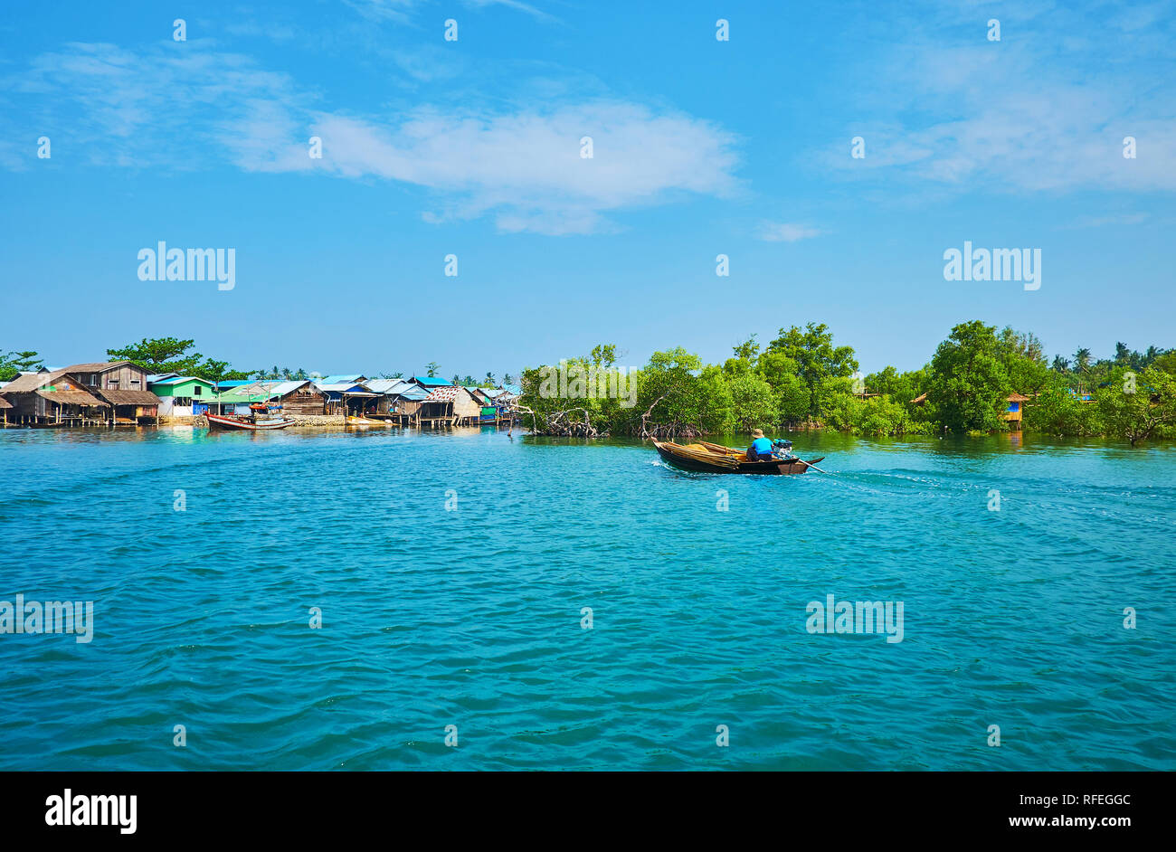Kayak, loaded with bamboo sticks floats across the Kangy river to the ...