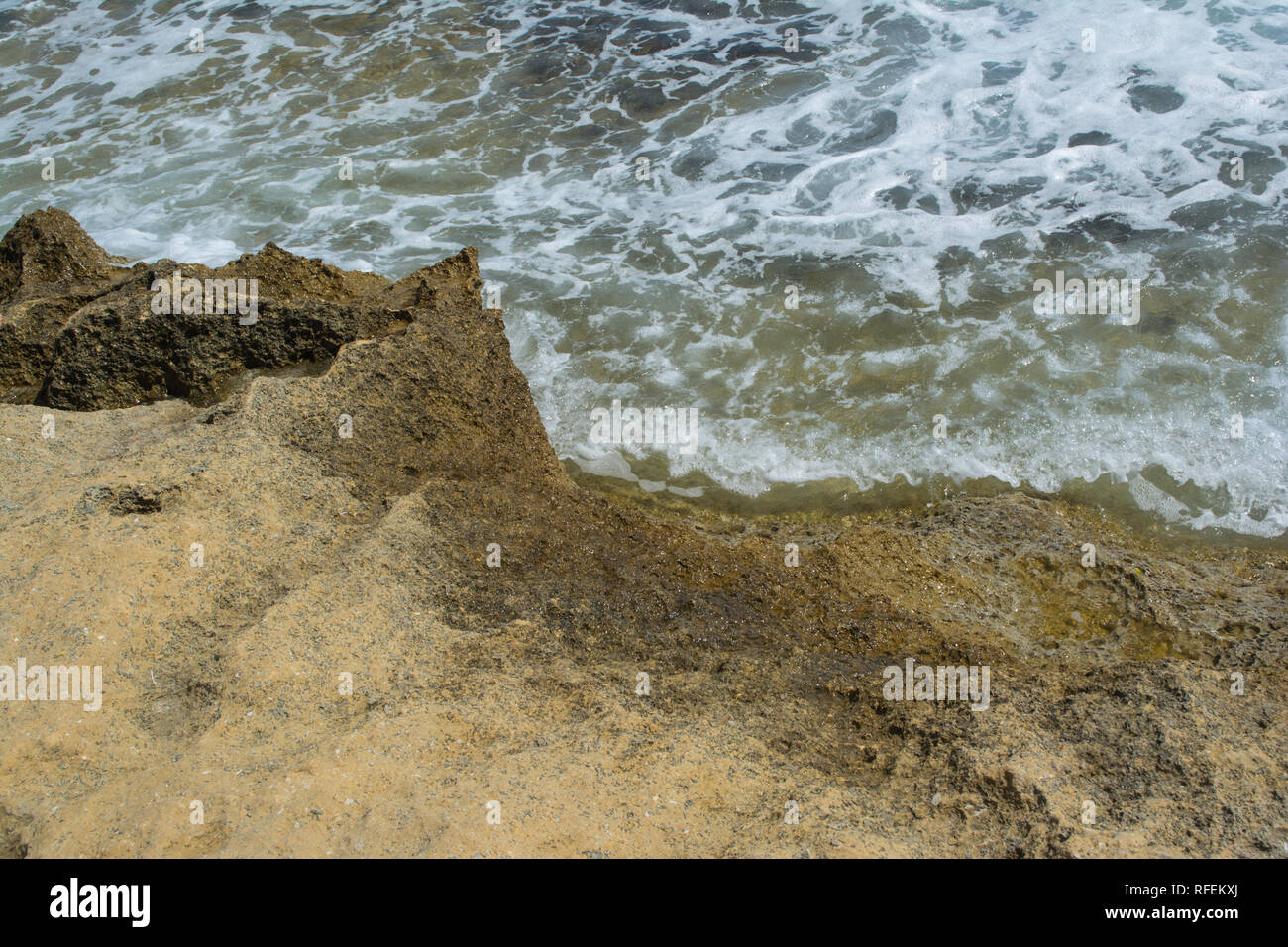 Waves hitting beach Stock Photo - Alamy