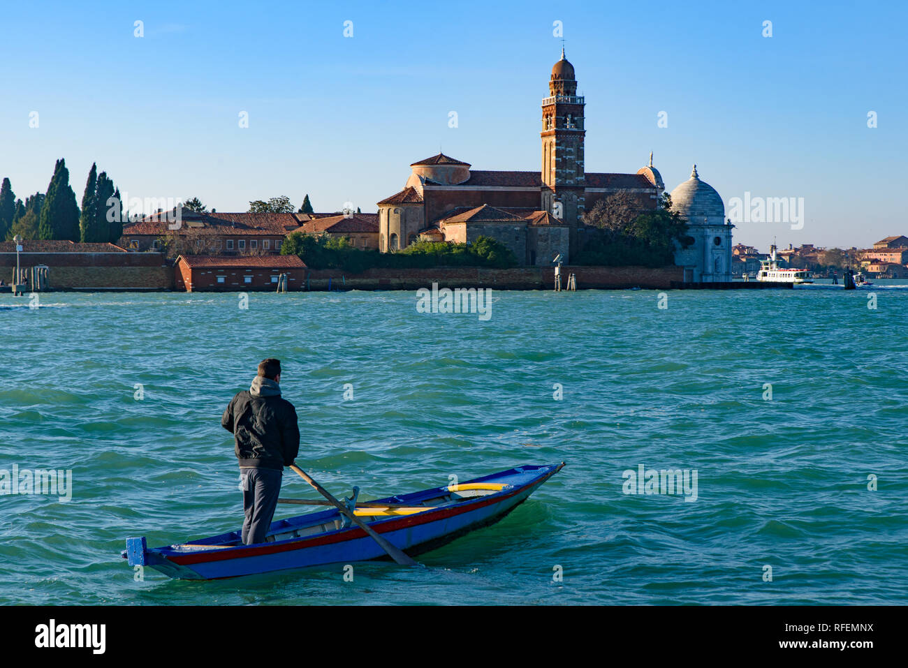 A man rowing the boat on the sea, Venice, Italy Stock Photo - Alamy