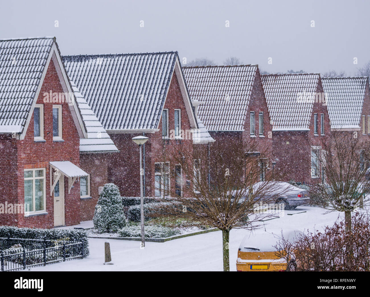 Modern dutch neighborhood during a cold winter day, snowy weather in ...