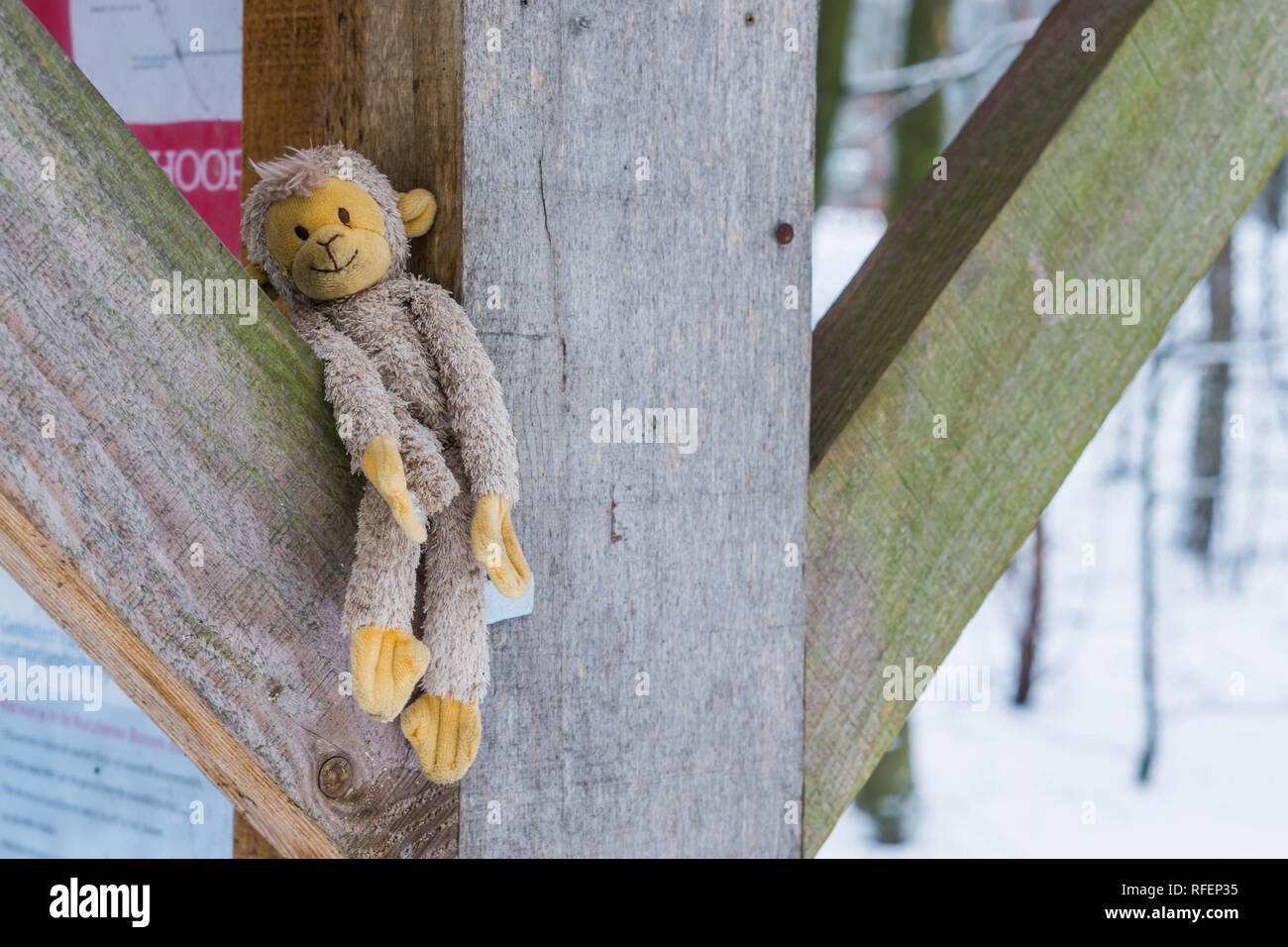 stuffed monkey between wooden beams, adorable cuddle toy for kids and ...