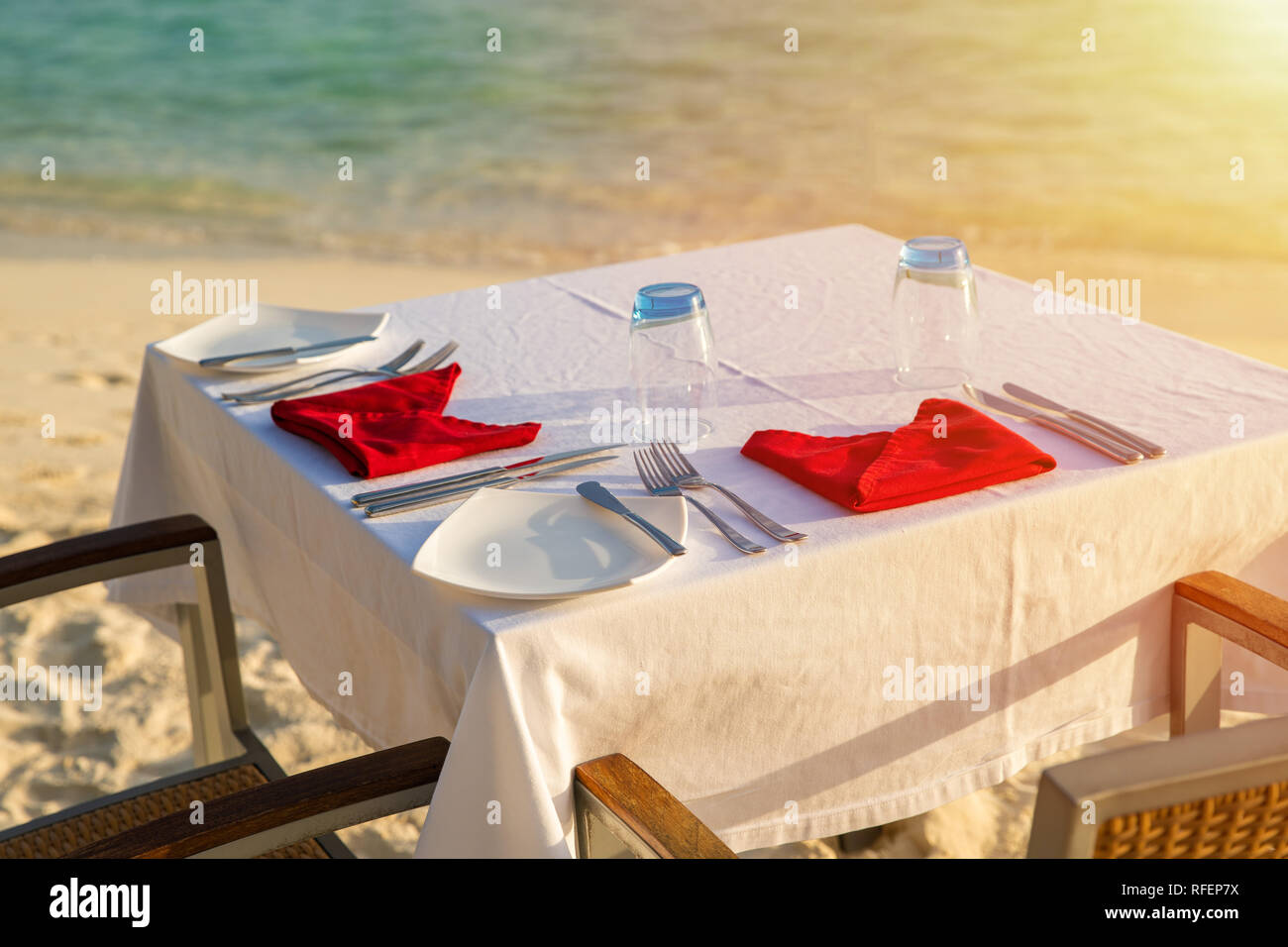 Table outdoor next to sea scenic prepare for special romantic dinner ...