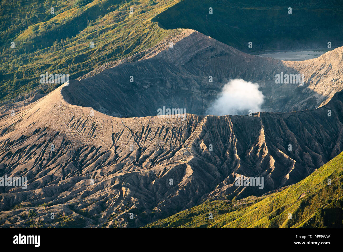 Bromo mountain with smoke from center Stock Photo - Alamy