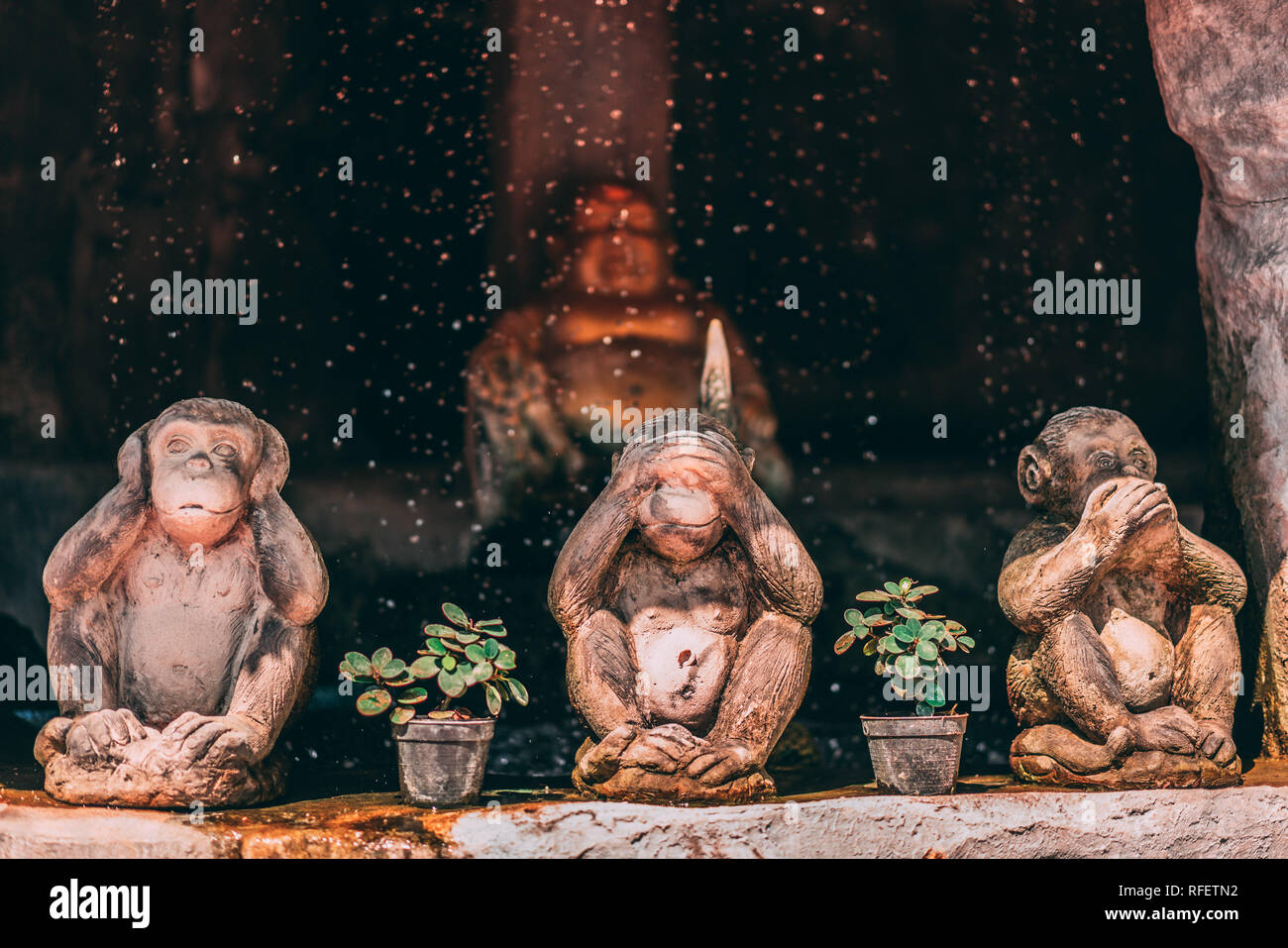 Statue at the Golden Mountain in Bangkok. 3 monkeys in the foreground ...