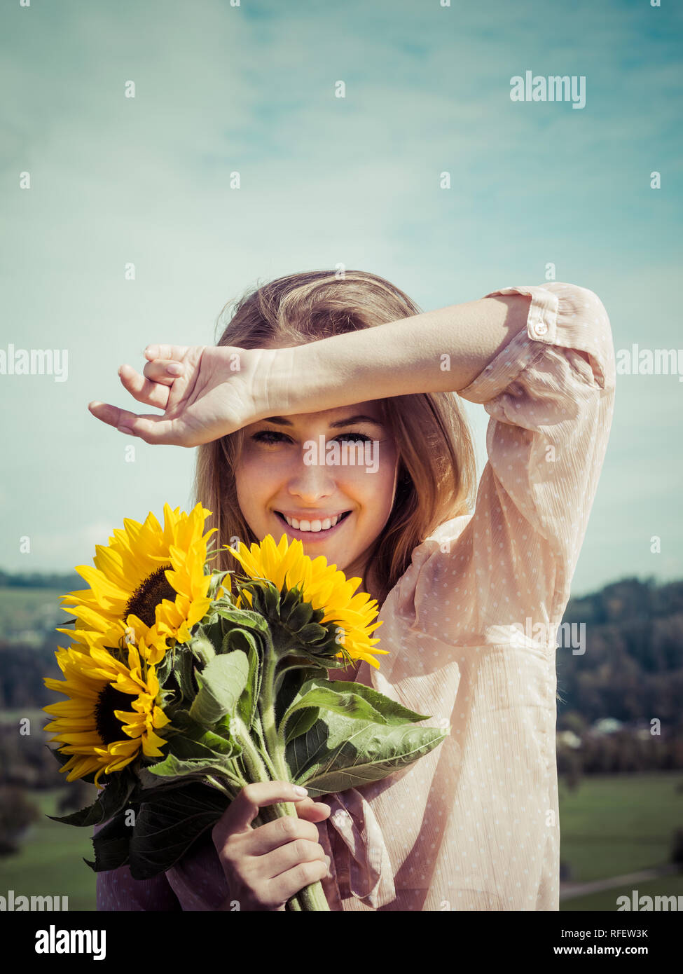 Person holding sunflower hi-res stock photography and images - Alamy