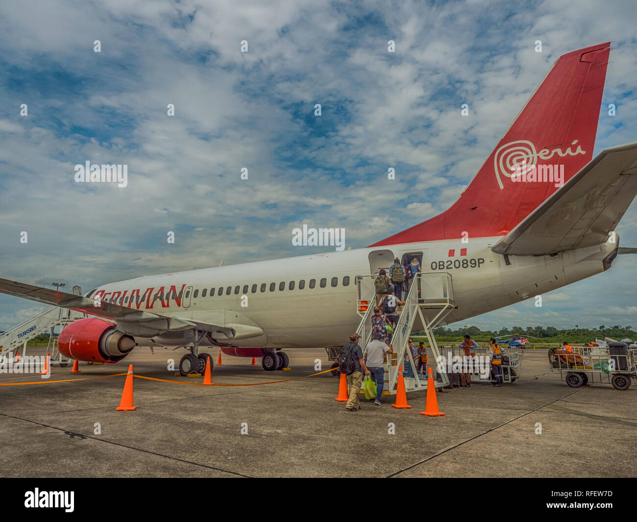 Iquitos, Peru - December 07, 2018: People entering into airplane at ...