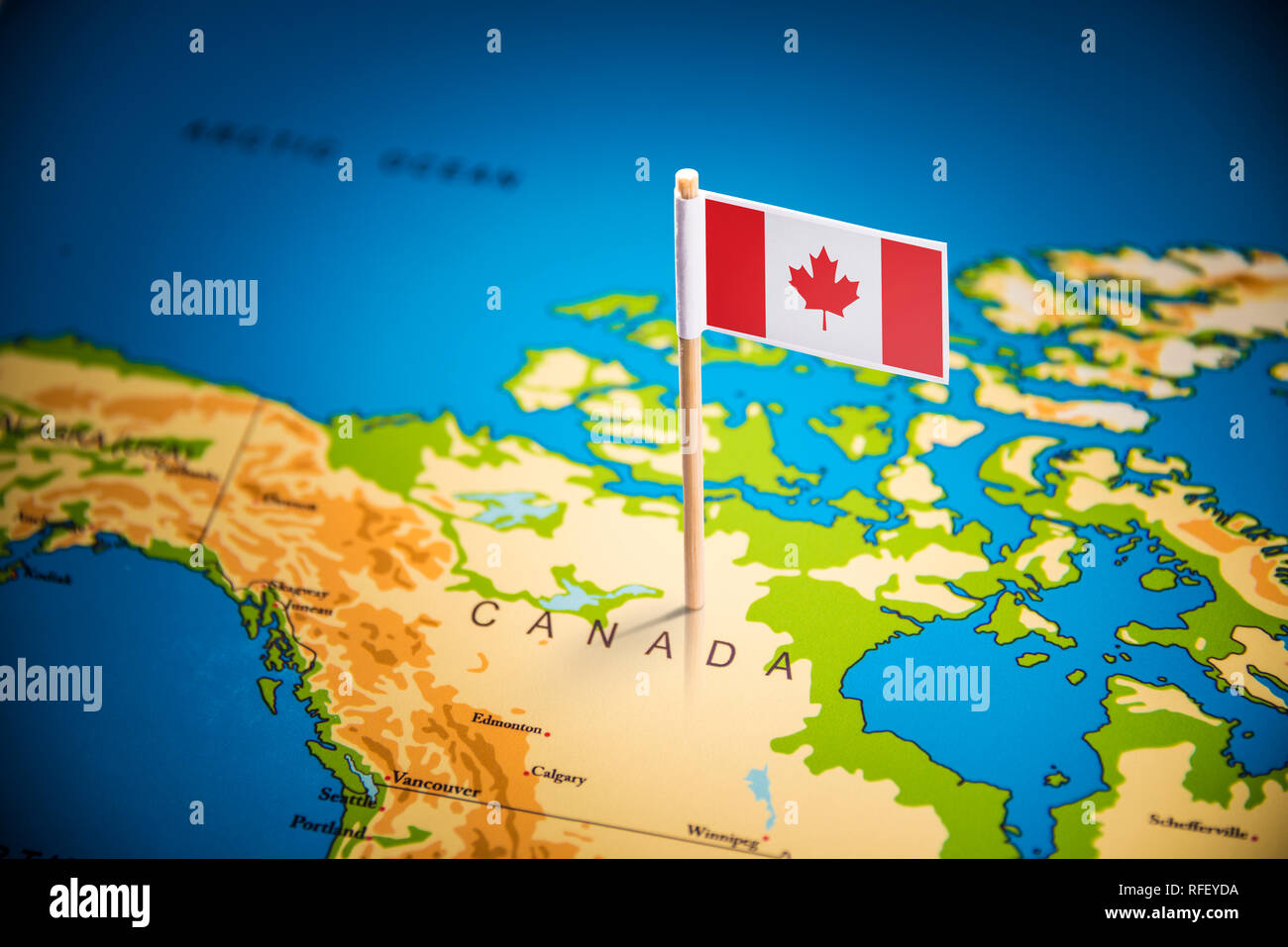 Canada marked with a flag on the map Stock Photo - Alamy