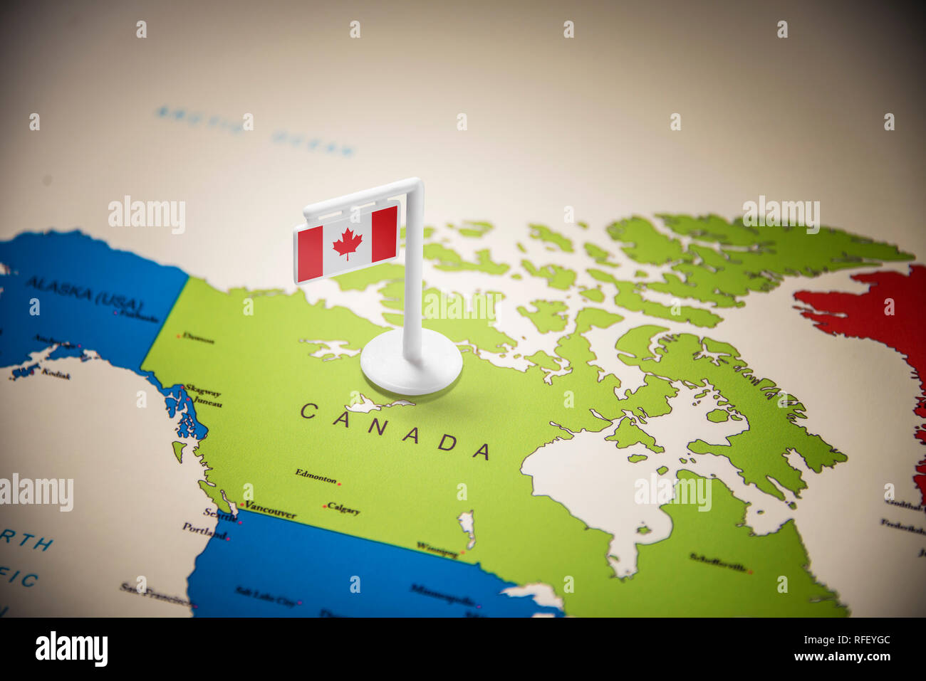 Canada marked with a flag on the map Stock Photo - Alamy