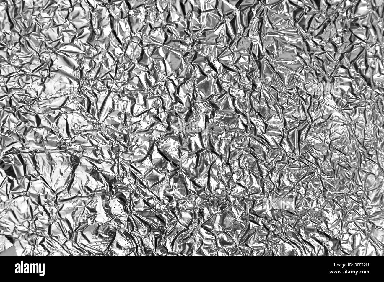 The crumpled silver foil is photographed close-up. Background Stock ...