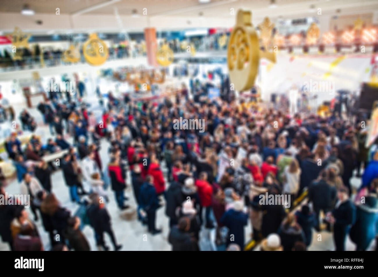Blured photo crowded concert hall with scene stage lights with people ...