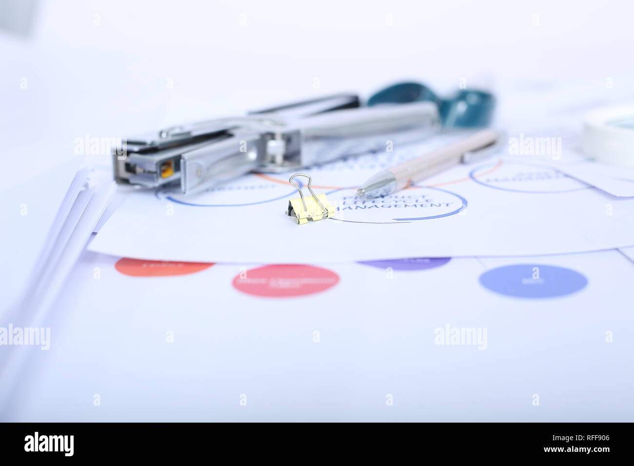 Picture of stapler, pen and paper clip on the office paper Stock Photo ...