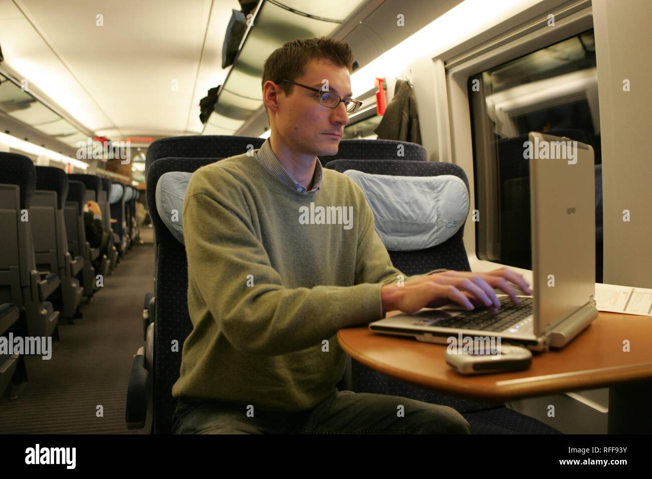Man works laptop computer ice train hi-res stock photography and images ...