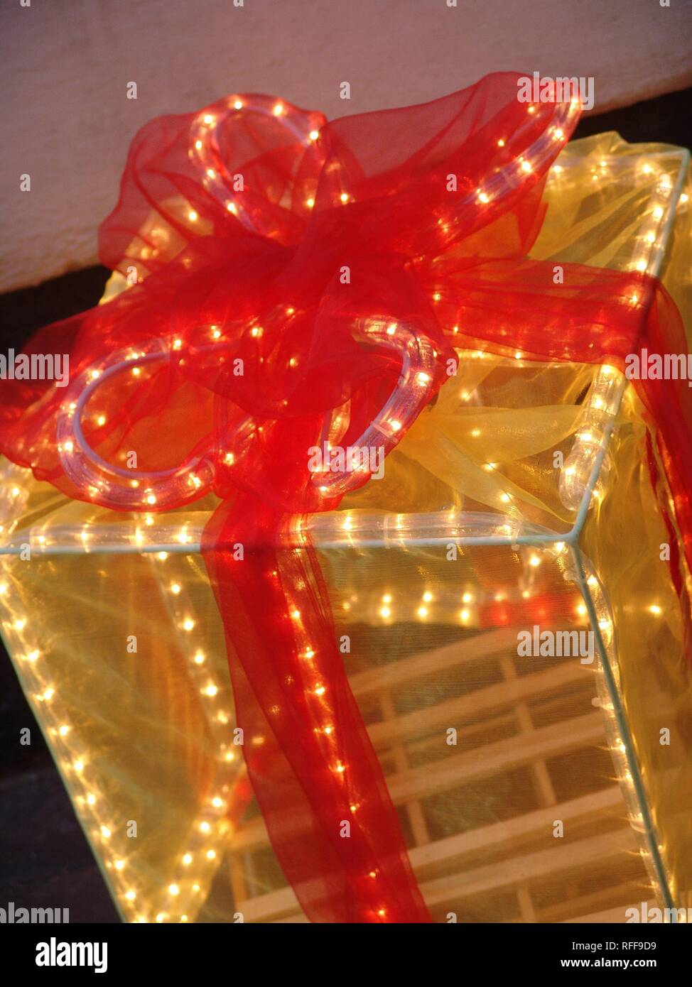 Illuminated present box Stock Photo - Alamy