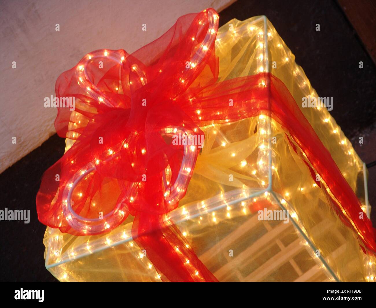 Illuminated present box Stock Photo - Alamy