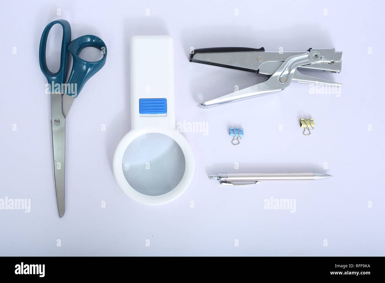 Picture of ball pen, stapler, scissor, paper clip and magnifying glass ...