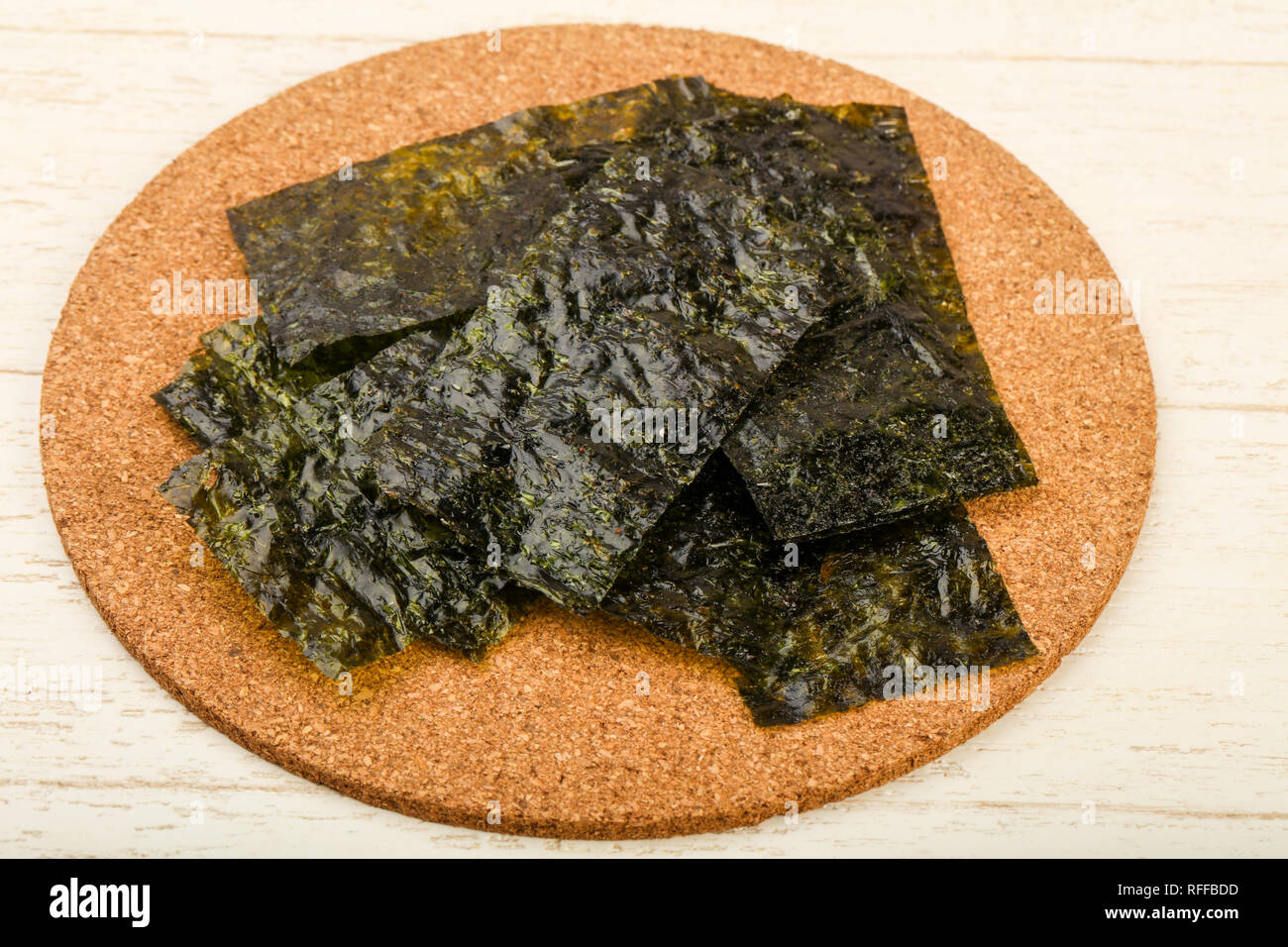 Crispy Nori sheets chips over wooden background Stock Photo - Alamy