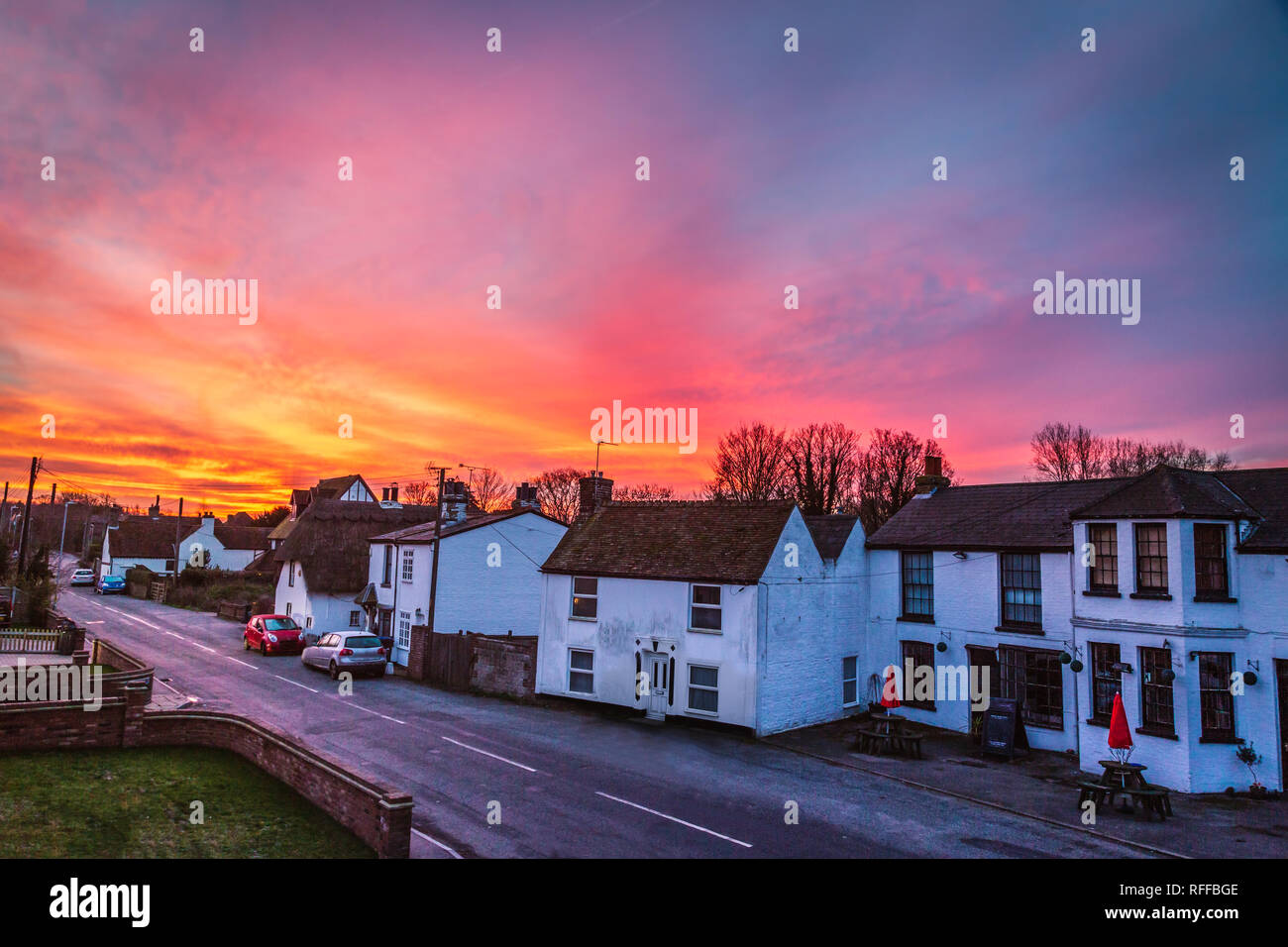 Dramatic sky over english village hi-res stock photography and images ...