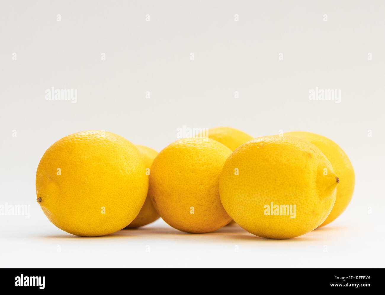 Six lemons isolated on white background Stock Photo - Alamy