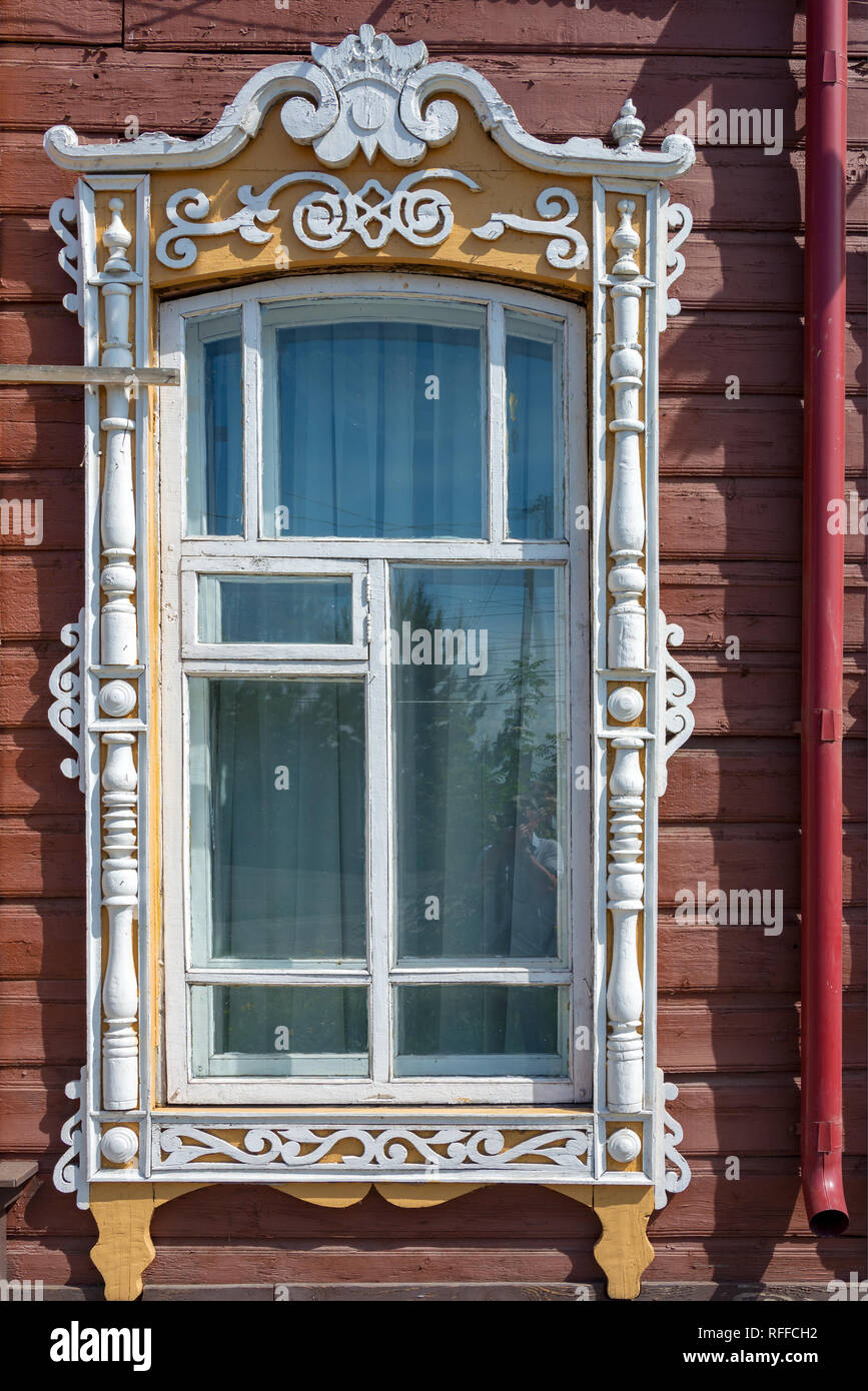 Fragment of the facade of an old wooden building, the former home of ...