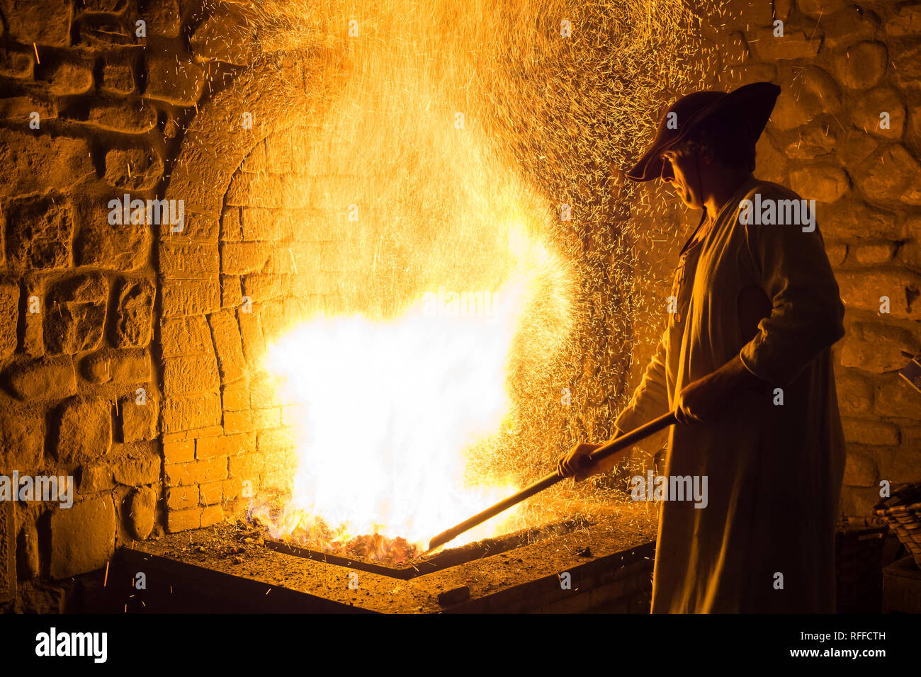 Blacksmith forging in the traditional way, as in the past, in the ...