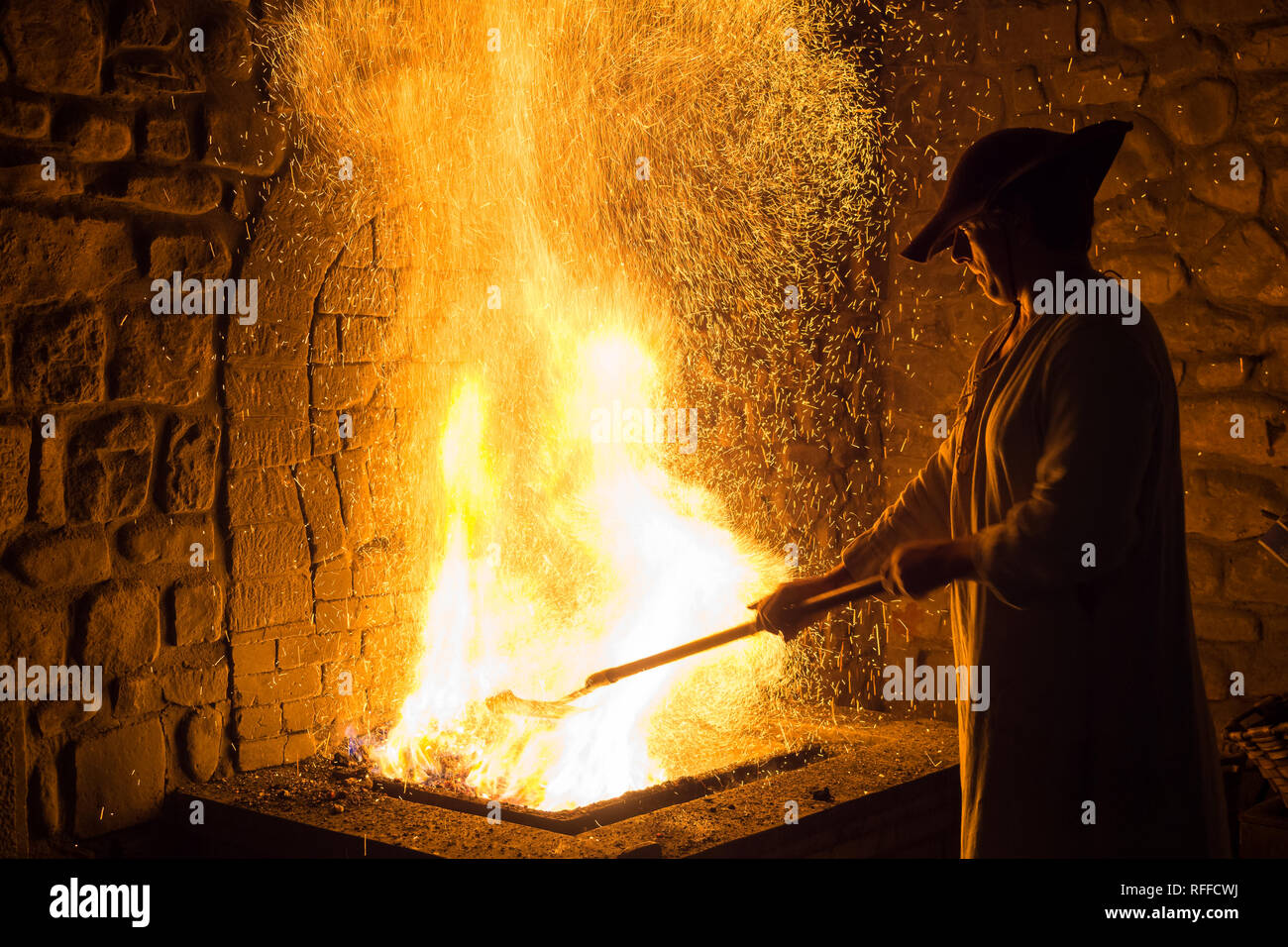Blacksmith forging in the traditional way, as in the past, in the ...