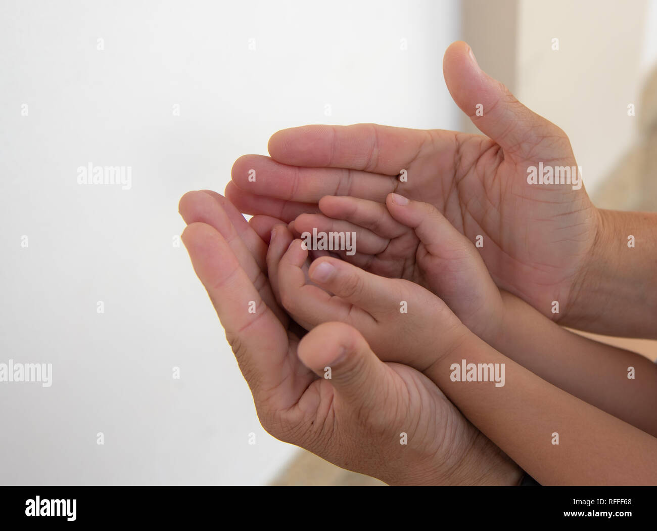 protection hand for support children hand Stock Photo - Alamy