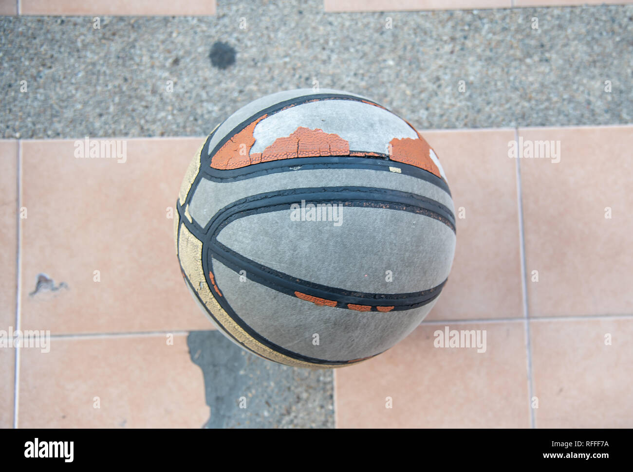 old basketball on ground Stock Photo - Alamy