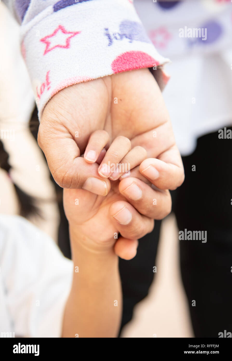 Helping hand children hi-res stock photography and images - Alamy