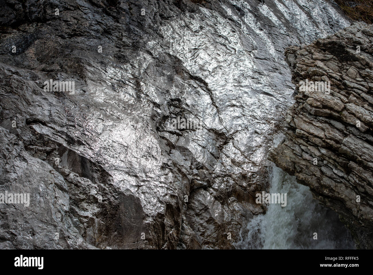 glistening rock and waterfall in the sun Stock Photo - Alamy