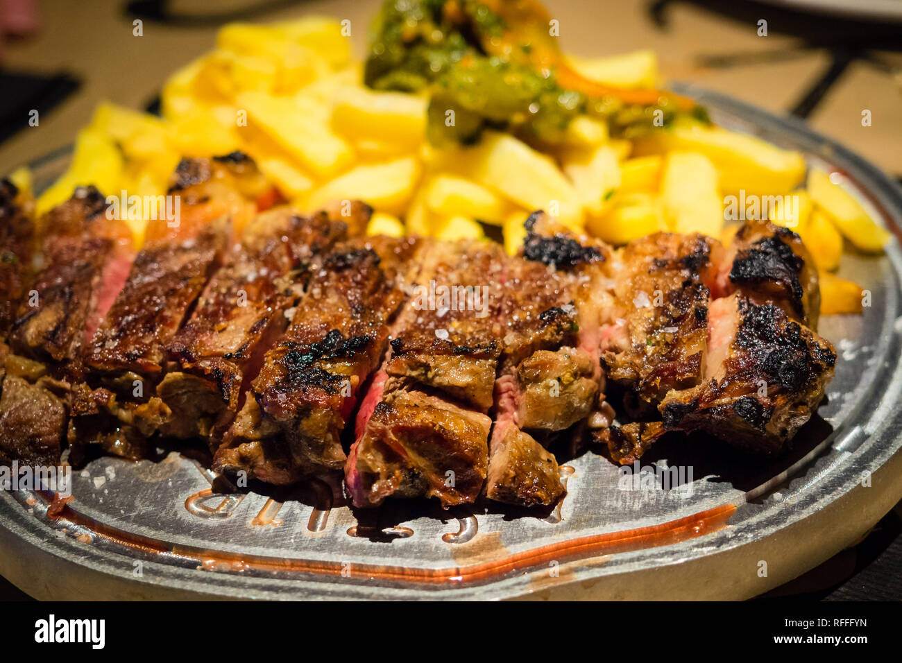 Little grilled beef steak with chips Stock Photo - Alamy