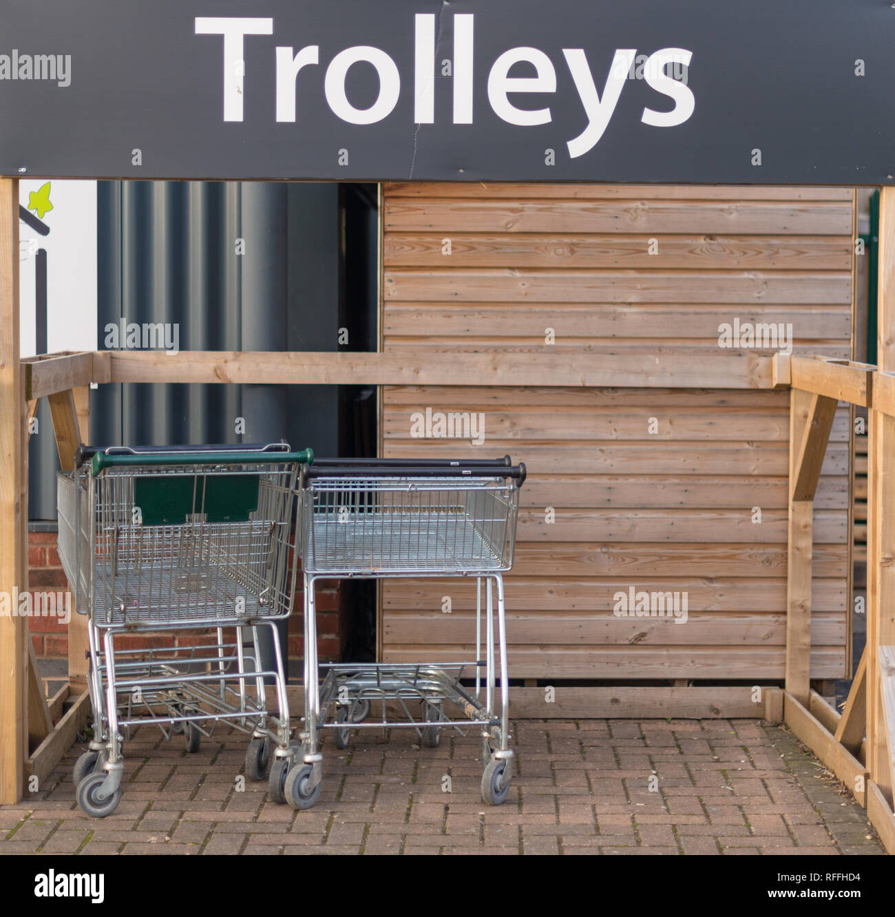 trolley park with sign and four trolleys in an enclosure Stock Photo ...