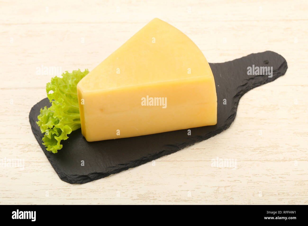 Parmesan cheese triangle Stock Photo - Alamy