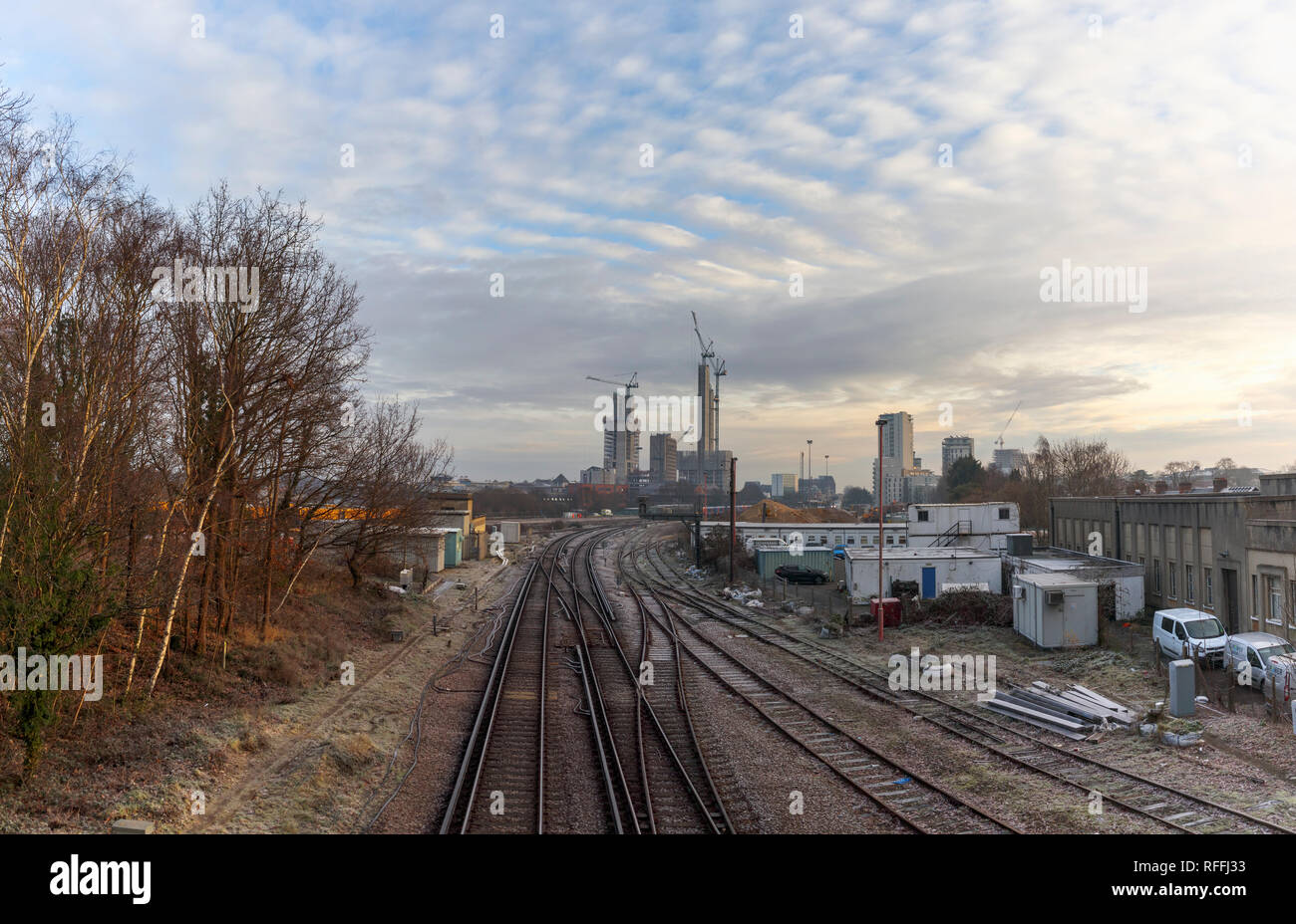 The changing skyline of Woking, Surrey: railway tracks lead into tower ...